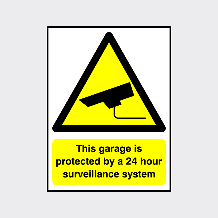 This garage is protected by a 24 hour surveillance system sign - The ...